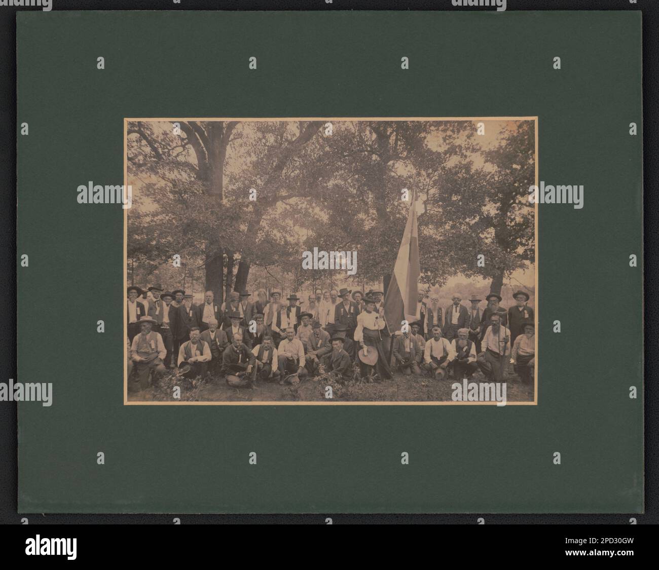 Unidentified Civil War veterans at reunion with woman holding first ...