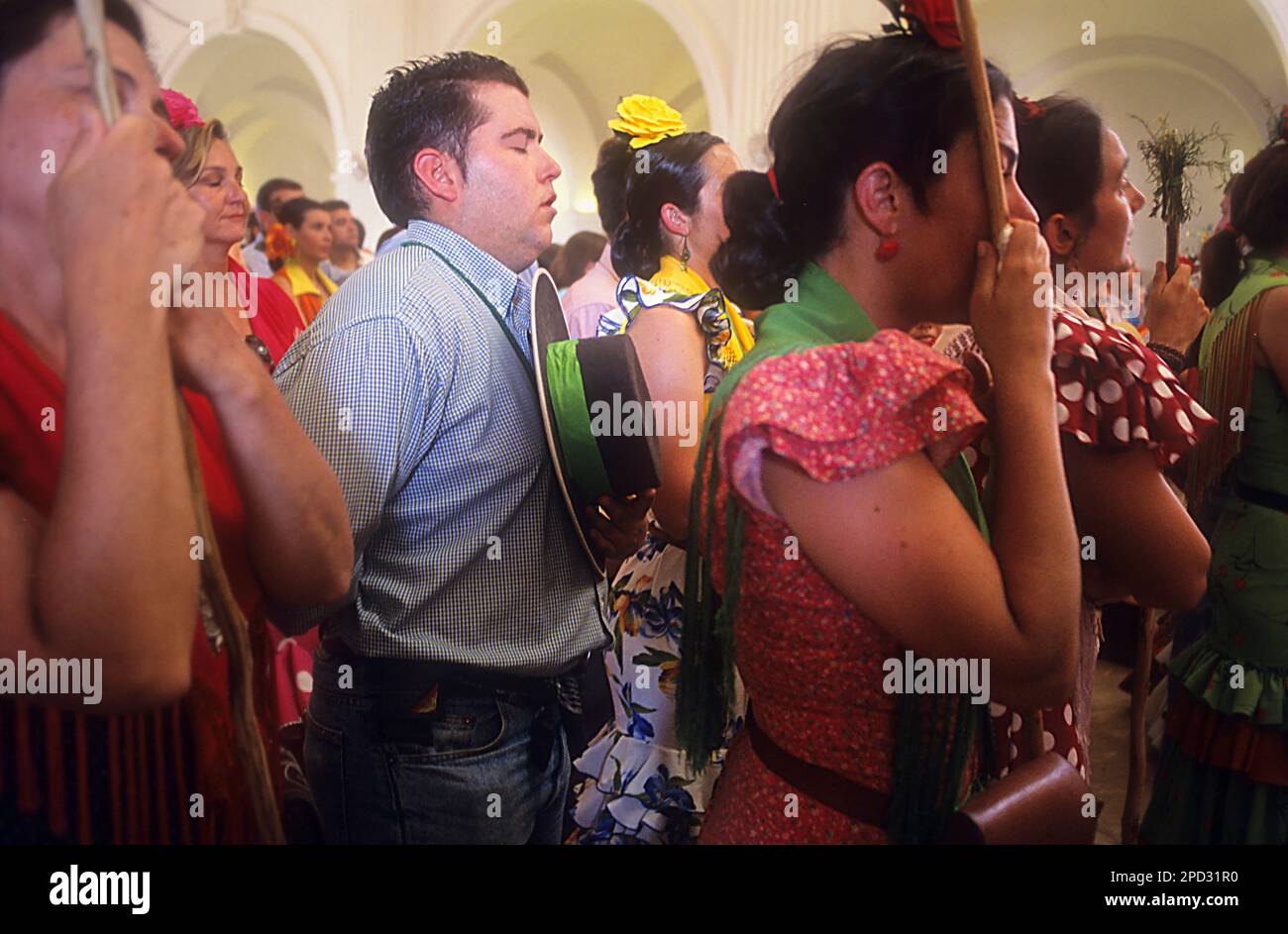 El Rocío Romería pilgrimage ,Pilgrims praying in front of the Blanca ...