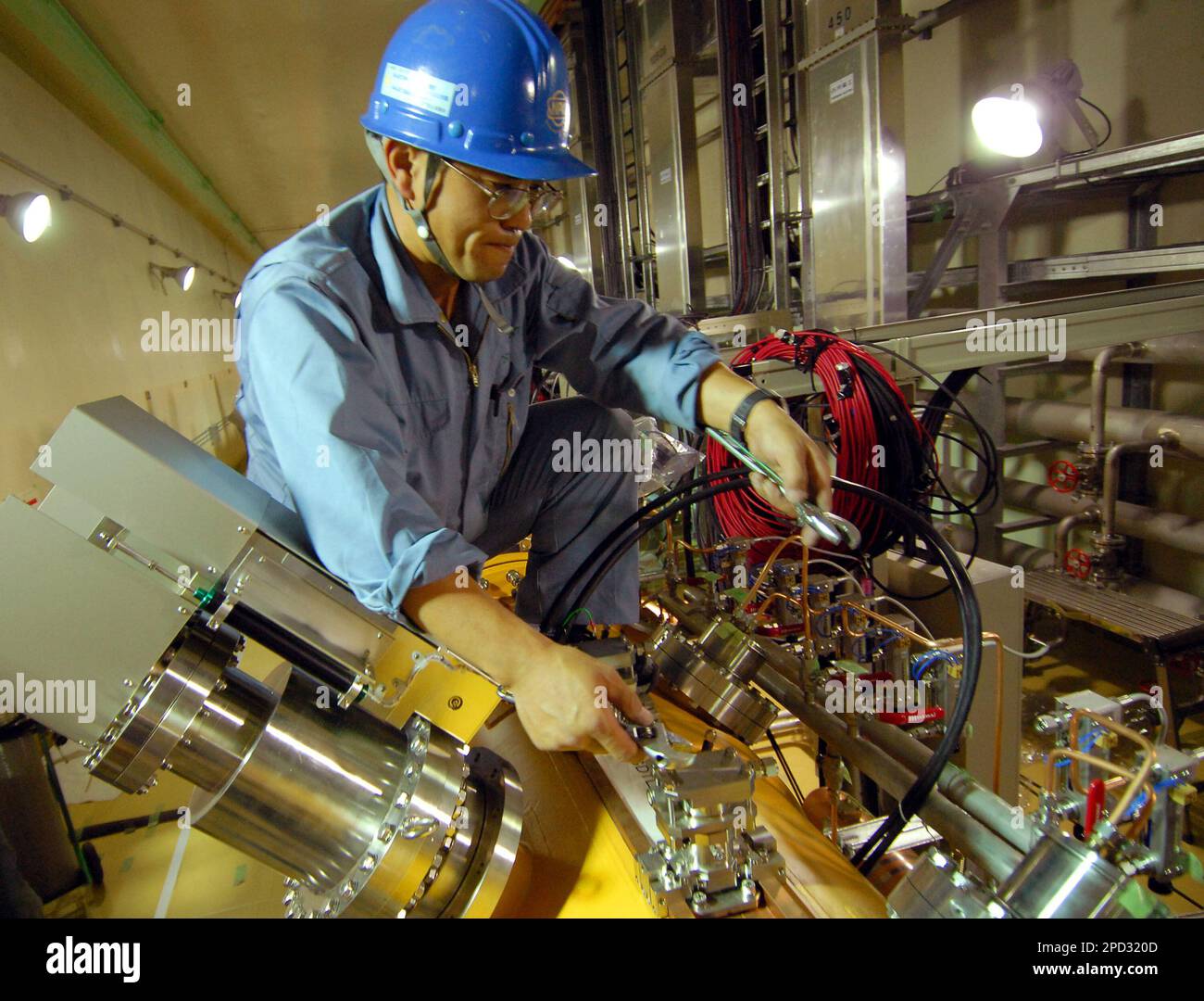 An engineer of Japan Proton Accelerator Research Complex (J-PARC) works ...