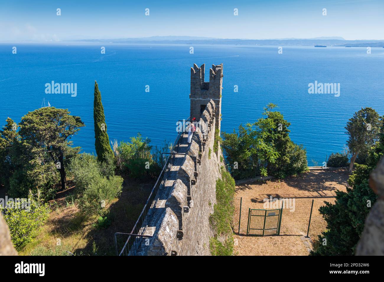 Medieval stone wall ending with turret facing the sea, medieval ...