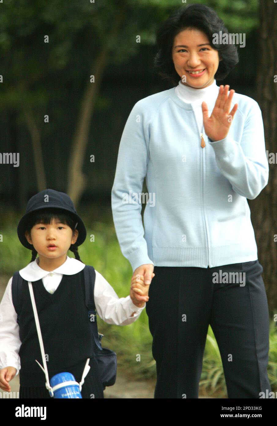 Crown Princess Masako, right, waves for photographers as she and her ...