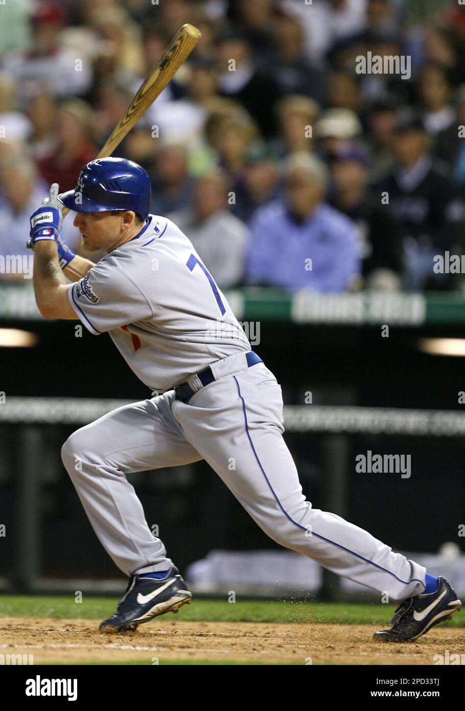Los Angeles Dodgers' J.D. Drew follows the flight of his double on a ...