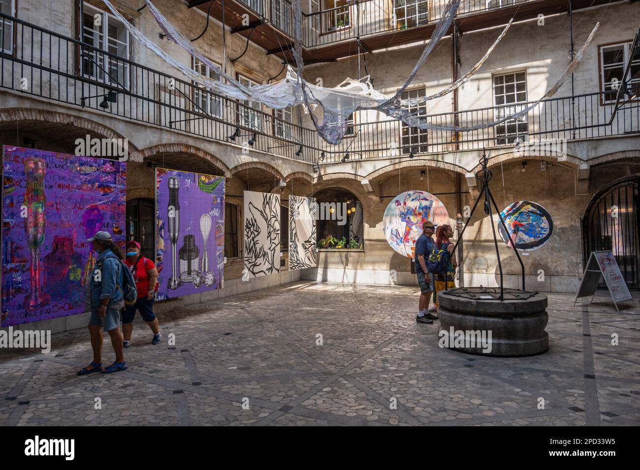 Right Atrium Town Hall courtyard with well and art exhibition in city ...
