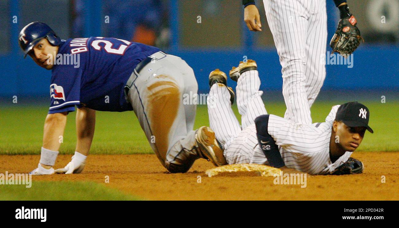 Texas Rangers Rod Barajas, left, and New York Yankees second baseman ...