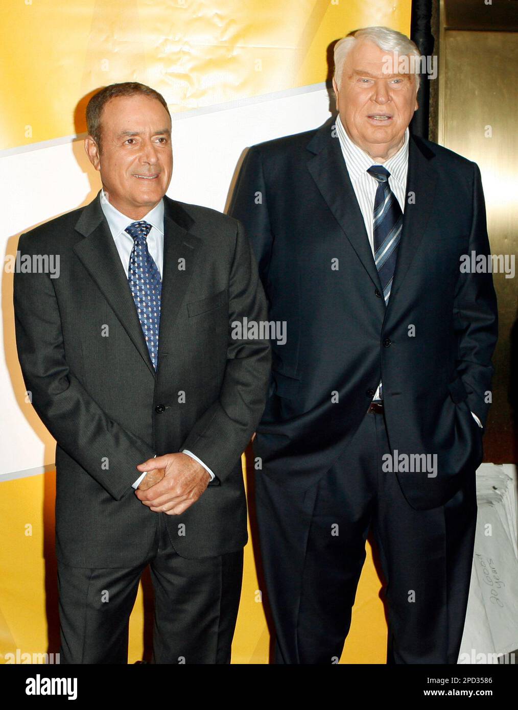 NFL broadcasters Al Michaels, left, and John Madden, right, pose during ...