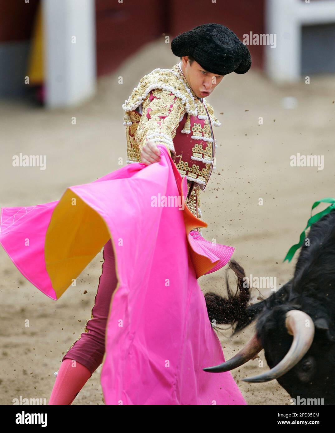 Spanish bullfighter Julian Lopez 'El Juli' performs a pass to a bull ...