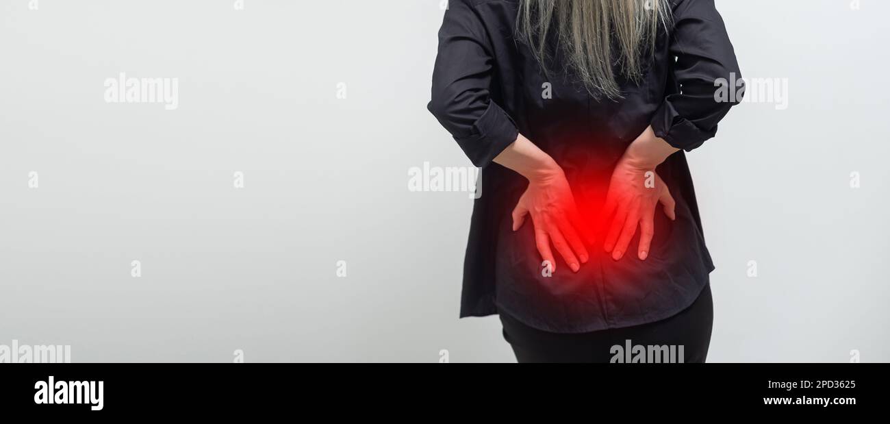 Backbone pain. Portrait of young female suffering from backache ...