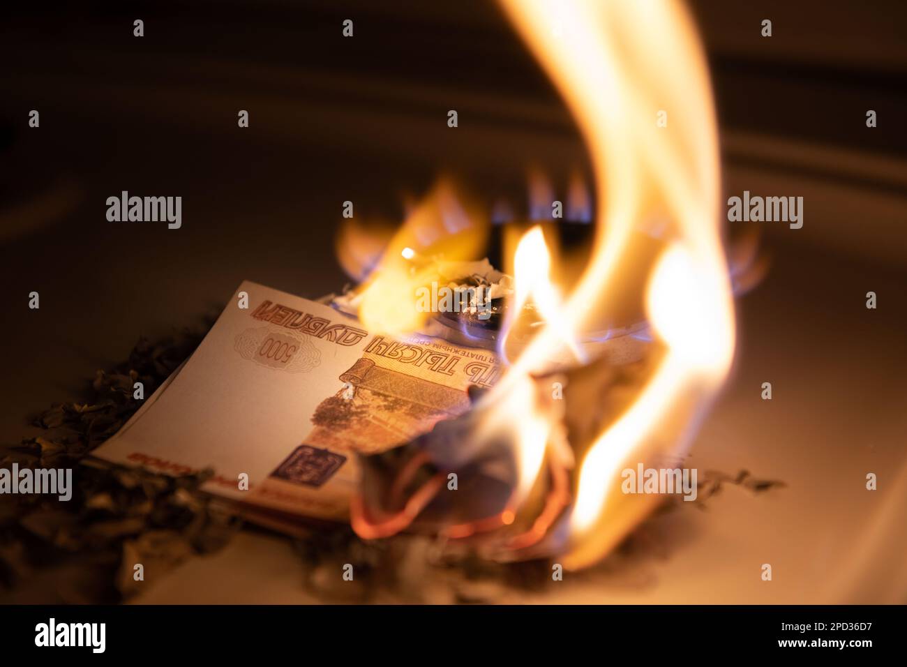 Burning rubles banknotes. High natural gas bills. Different ...