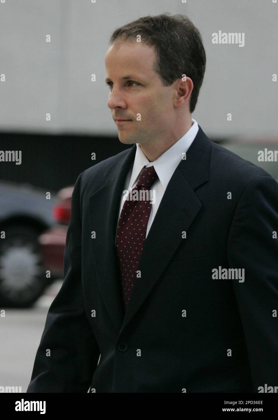 Lead federal prosecutor John Hueston arrives at the courthouse for ...