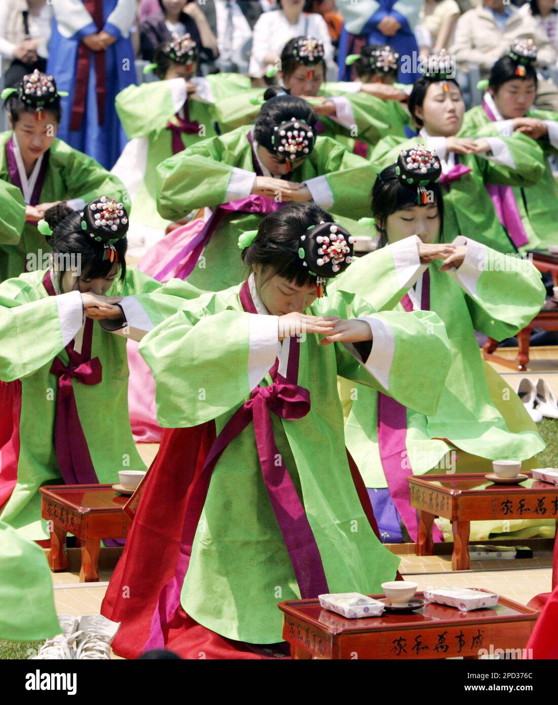 Girls bow during the 34th Coming of Age Day Ceremony and re ...