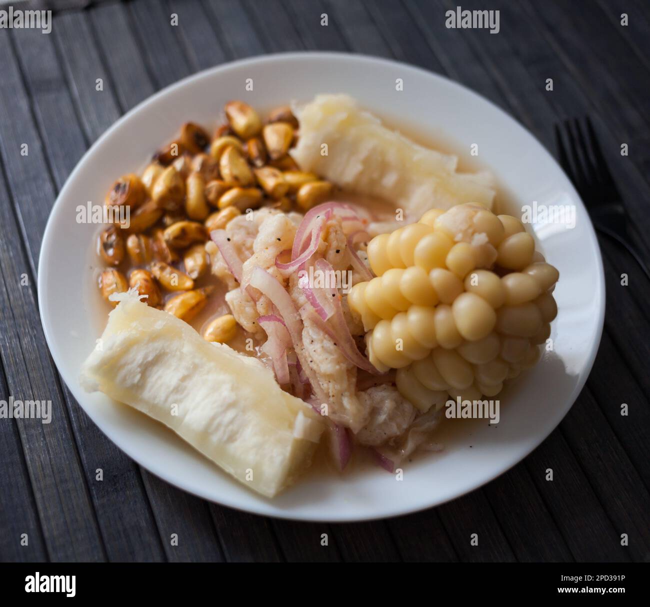 Peruvian traditional dish.fish ceviche with yuka and corn Stock Photo ...