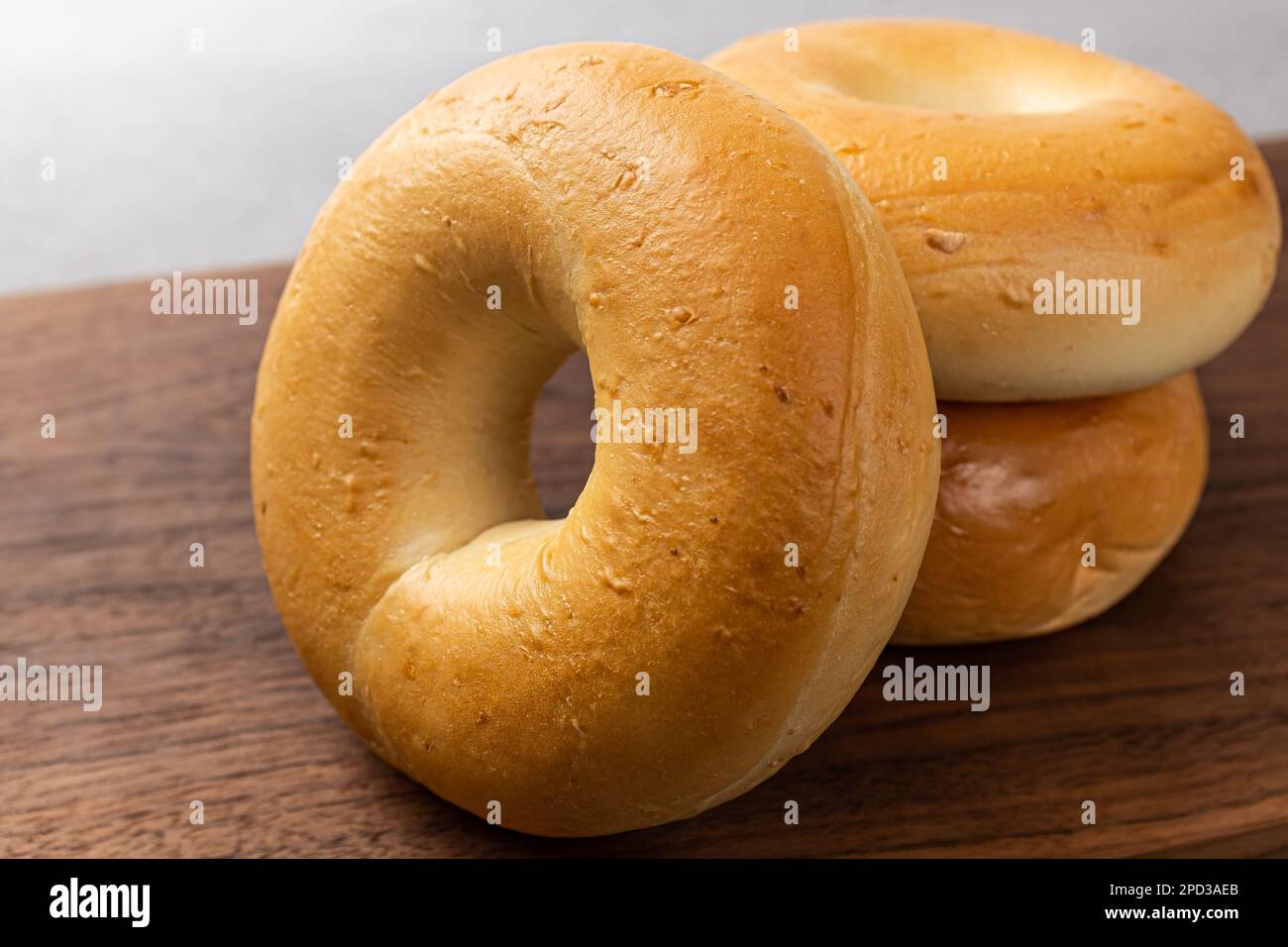 Ring-shaped thick bread plain bagel Stock Photo - Alamy