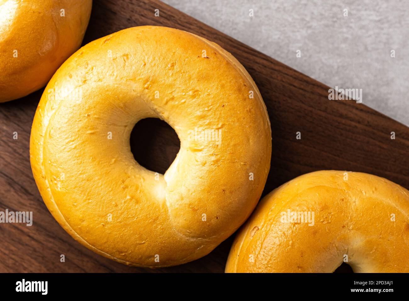 Ring-shaped thick bread plain bagel Stock Photo - Alamy