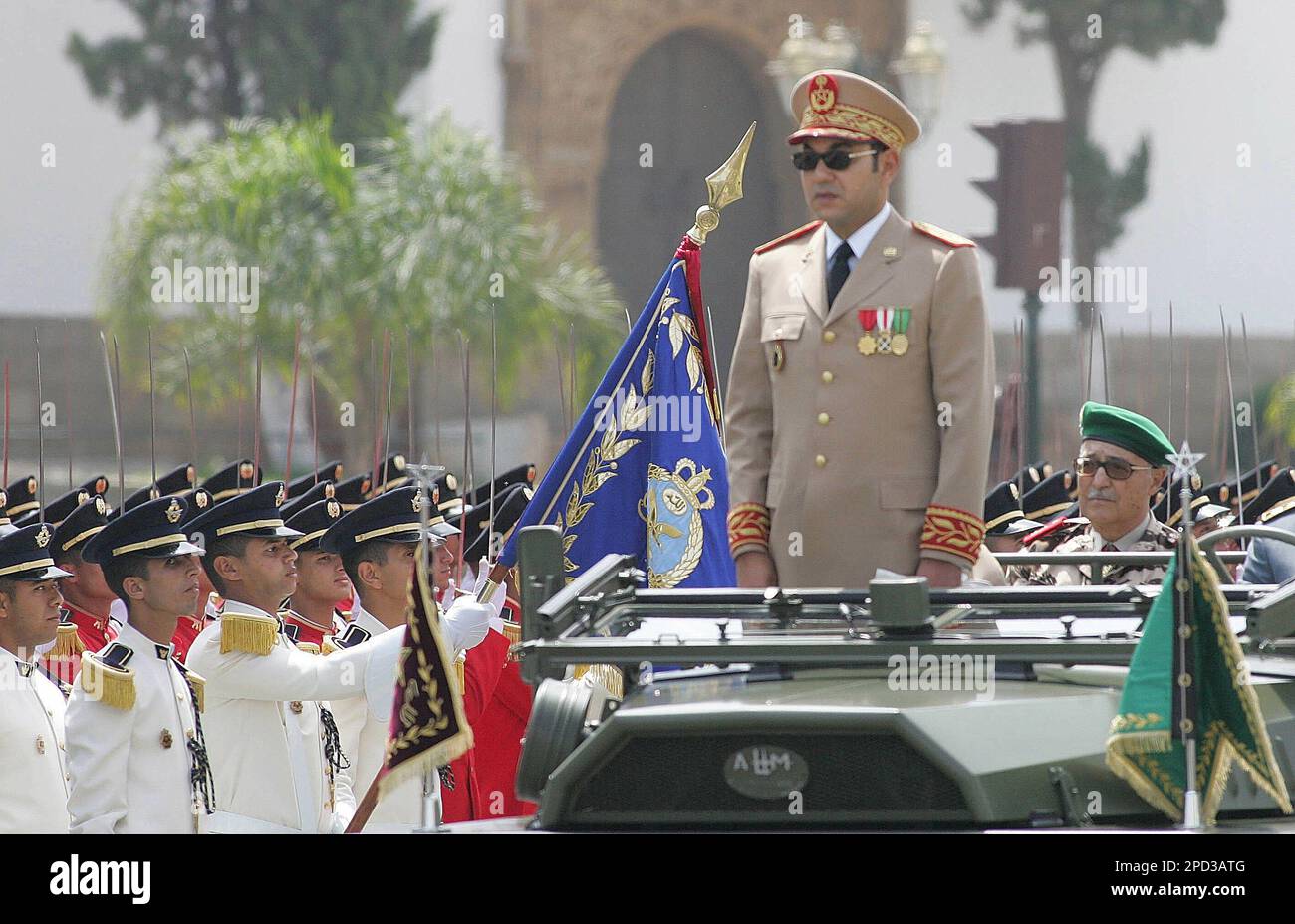 Moroccan King Mohammed VI reviews a regiment of the royal army in Rabat ...