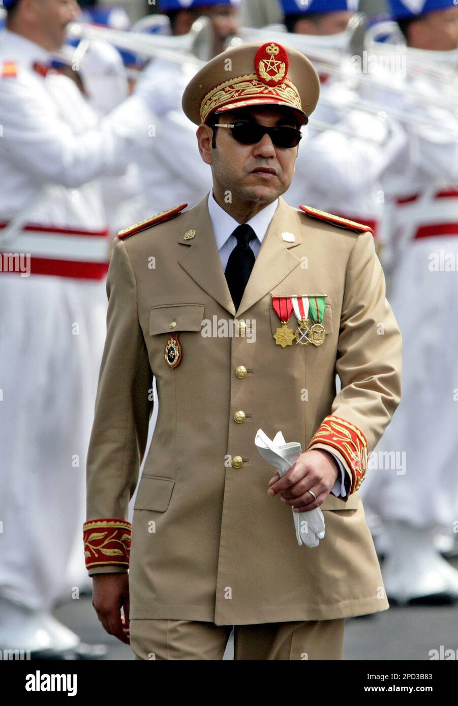 Moroccos king Mohammed VI reviews troops during a military parade to ...