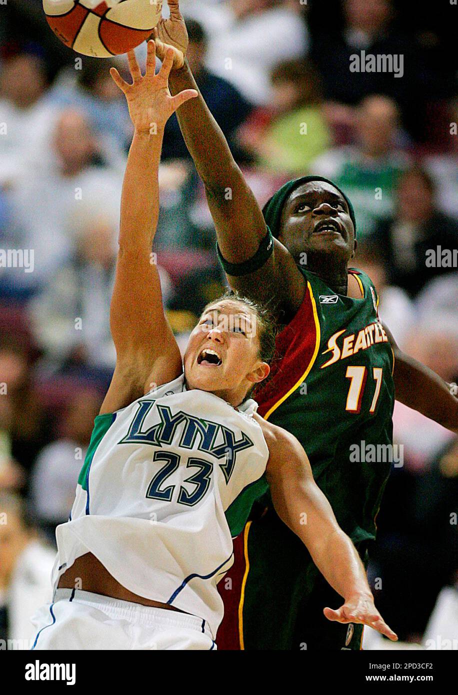 Minnesota Lynx guard Amber Jacobs (23) fights for a rebound with ...