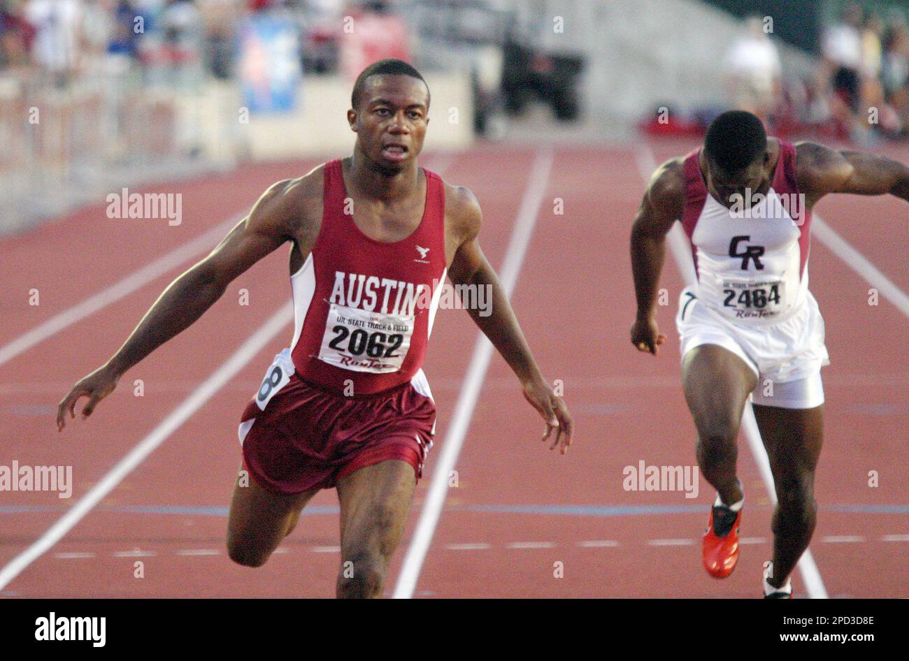 Austin High School's Mychal Dungey, left, crosses the finish first to ...