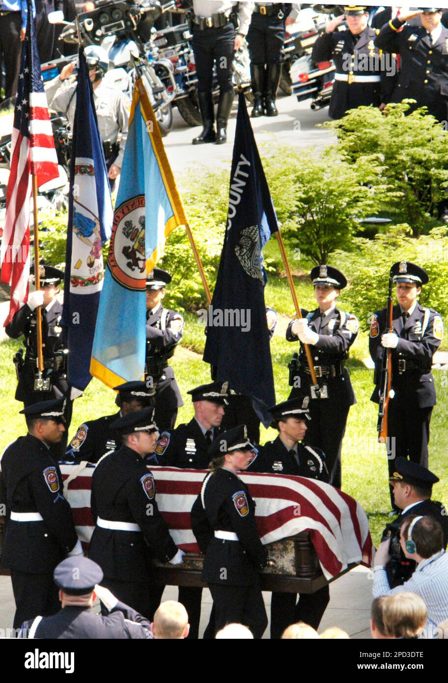 Fellow officers salute as pallbearers carry the casket of slain Fairfax ...