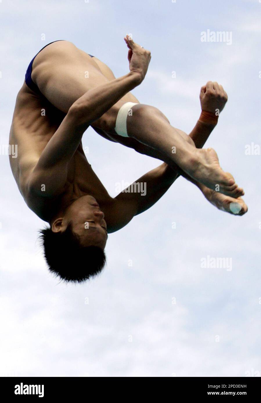 Luo Yutong of China competes in the men's 3-meter springboard final at ...