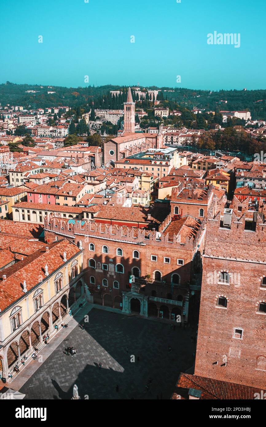 Sunny day in Verona, Italy. View from above on old town red roofs ...