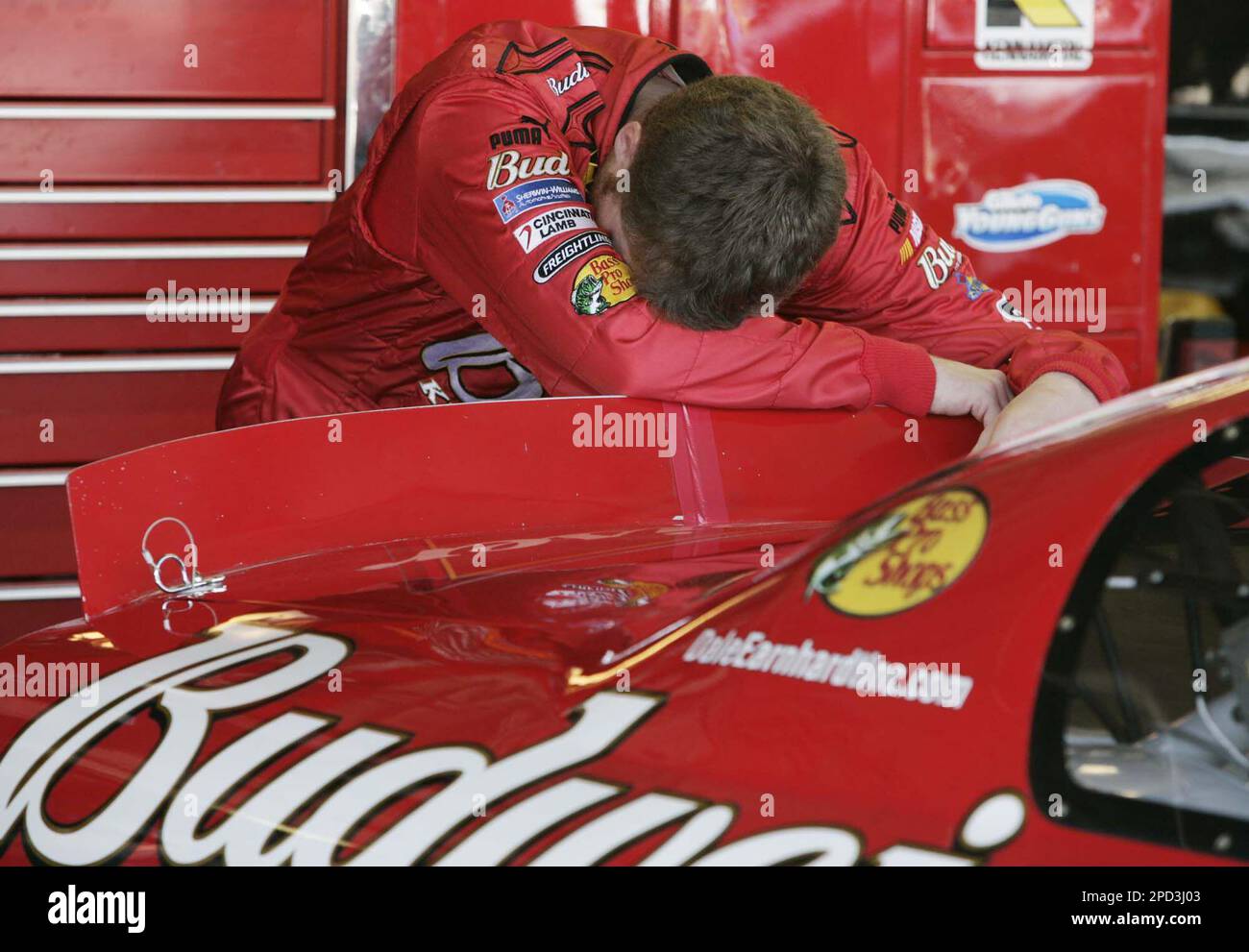 Dale Earnhardt Jr. rests on his car before the start of practice for ...