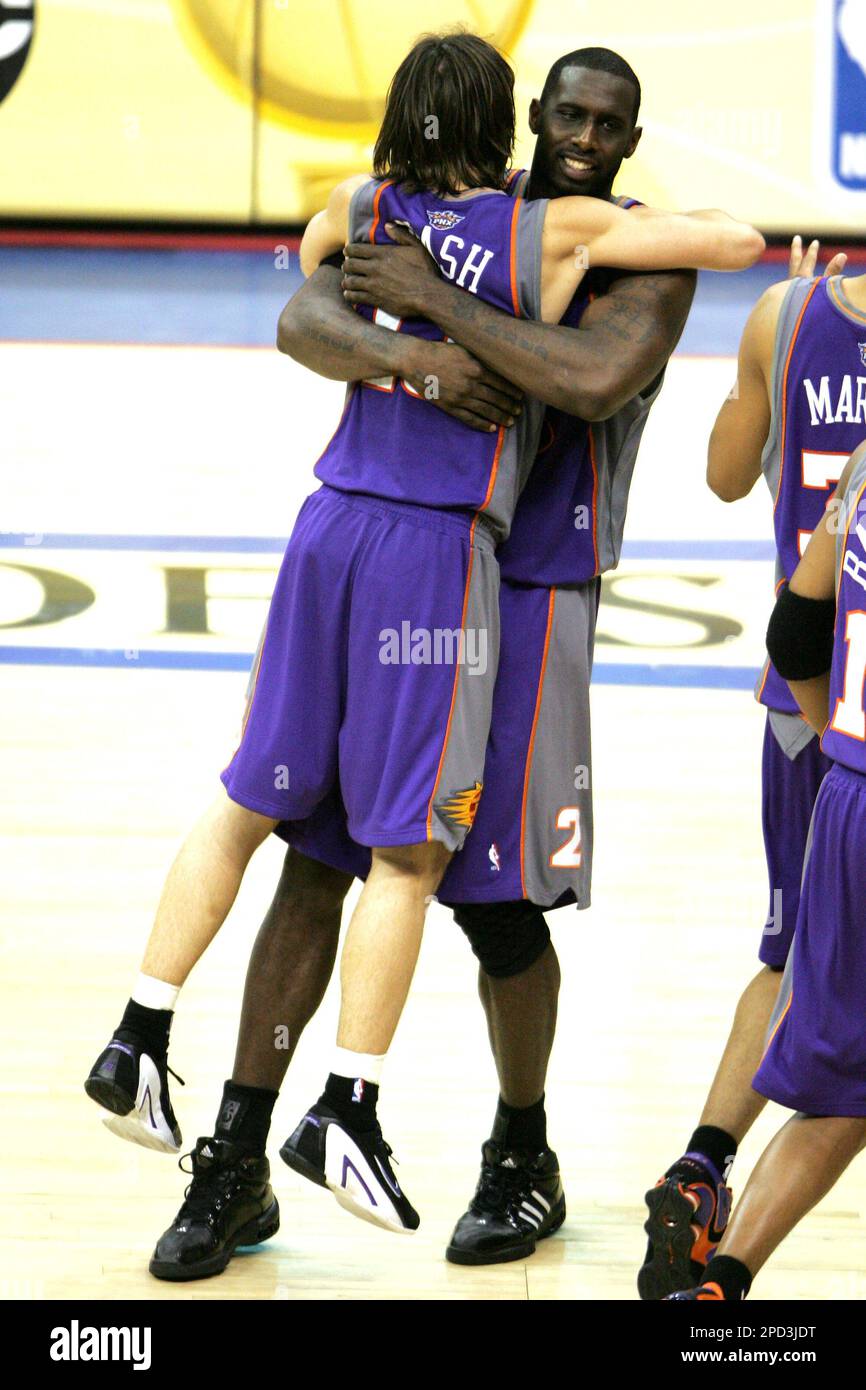 Phoenix Suns' Tim Thomas, right, hugs teammate Steve Nash after the ...