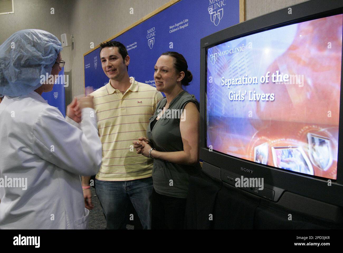 Jesse Carlsen, center, and Amy Carlsen, parents of conjoined 5-month ...