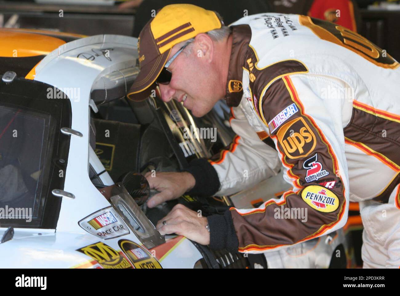NASCAR driver Dale Jarrett looks inside his car during practice for the ...