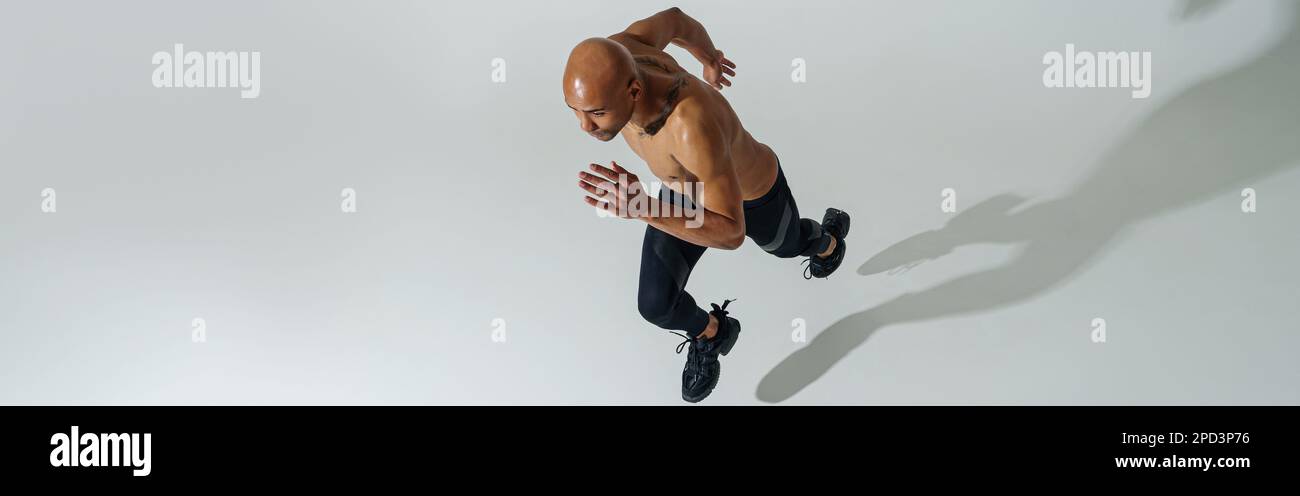 Top view of Professional male athlete running isolated on white studio ...