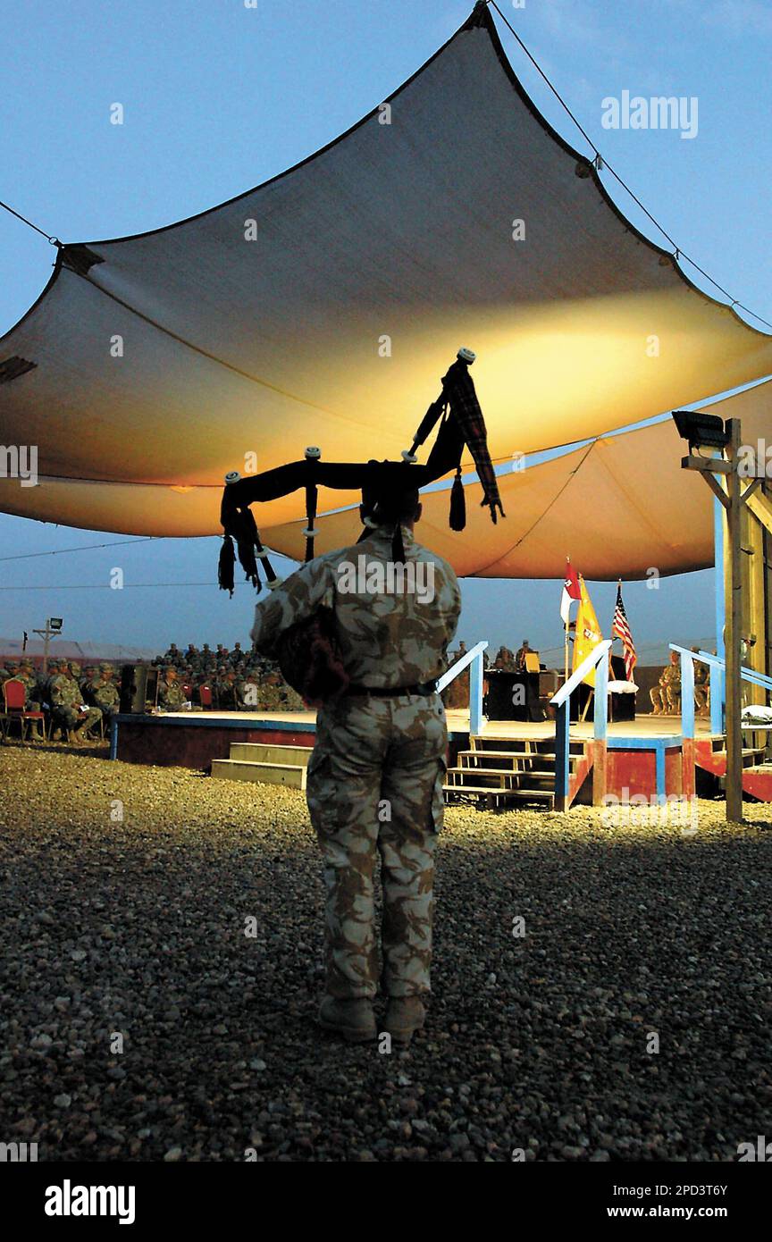 Pete McIntyre, a British paratrooper, plays "Amazing Grace" on the ...