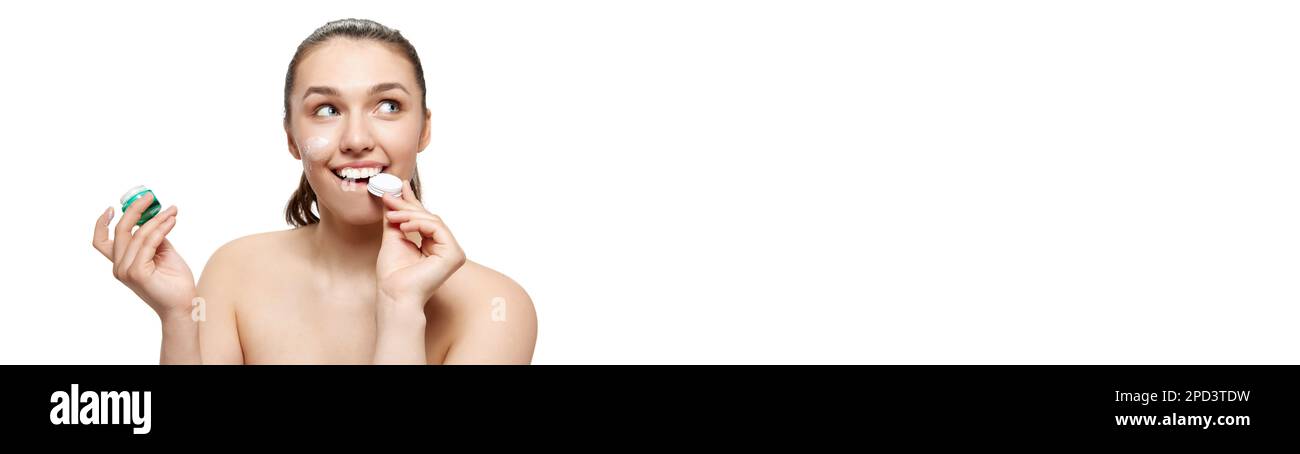 Happy beautiful young woman with smooth clean face skin posing over ...