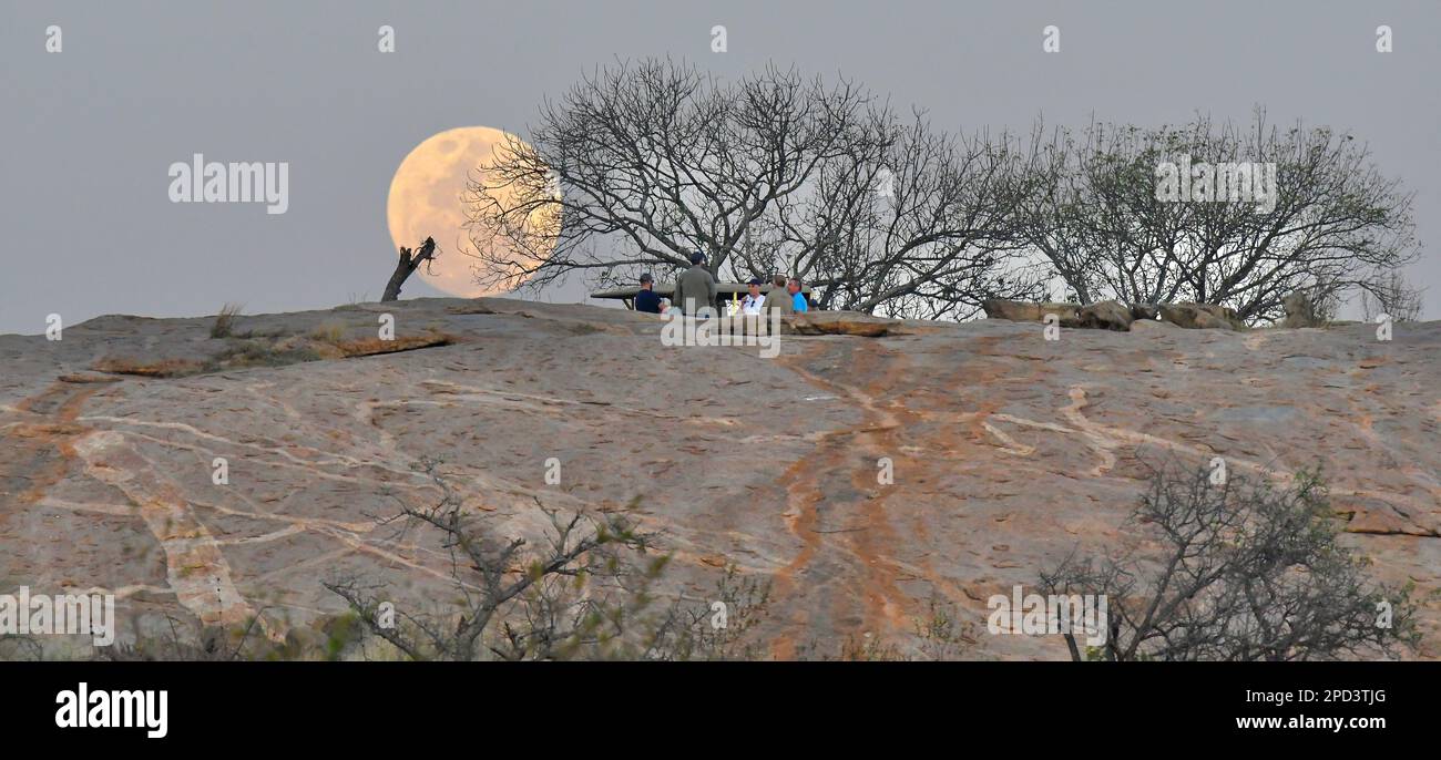Full moon rising over rocky hill, Kruger national park, South Africa ...
