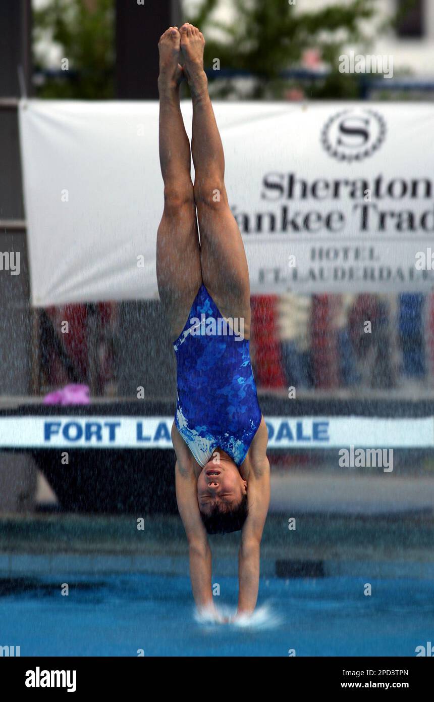 Jia Tong, of China, hits the water during the women's platform ...