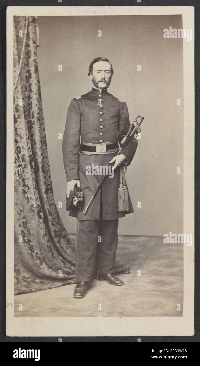 Unidentified soldier in uniform with hat and sword. Title devised by ...