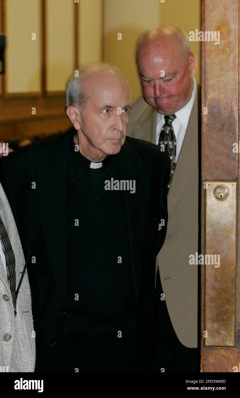 The Rev. Gerald Robinson is lead from the courtroom by court security ...
