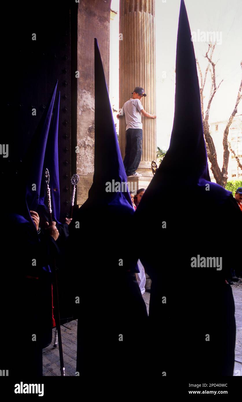 Penitents and spectator. Good Friday.In plaza de Santo domingo ...
