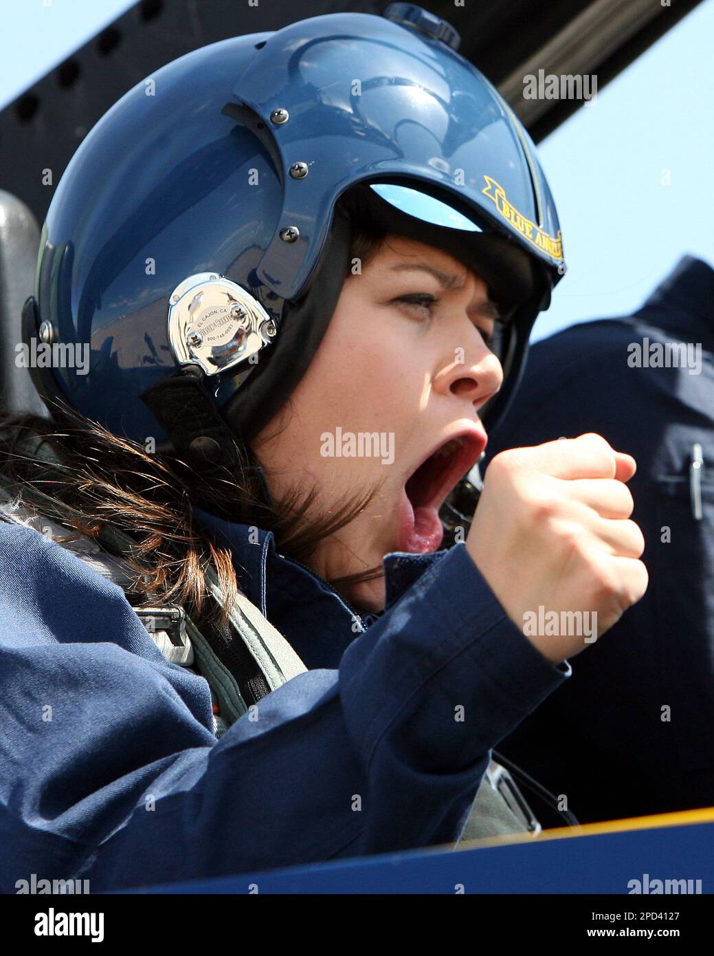 Singer Kelly Clarkson pumps her fist before going on a flight with the ...