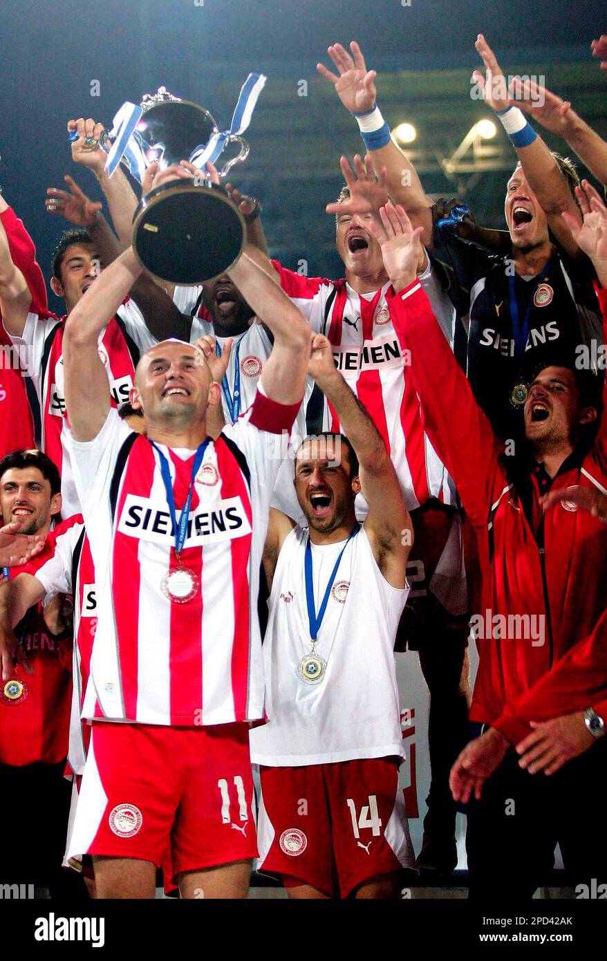 Olympiacos' captain Predrag Djordjevic of Serbia lifts the Greek Cup ...