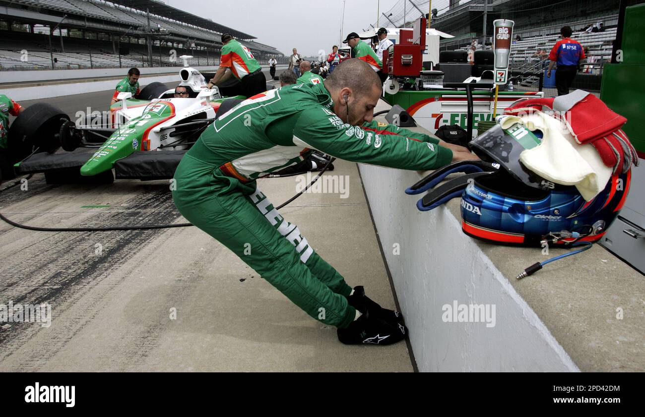 Indy Racing League driver Tony Kanaan of Brazil, stretches against the ...
