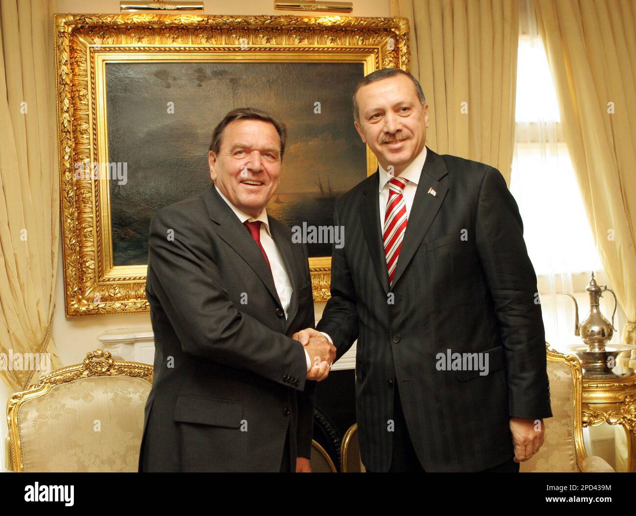Former German Chancellor Gerhard Schroeder, left, and Turkish Prime ...