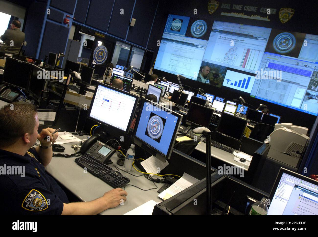 New York Police Dept. officers work in the Real Time Crime Center at ...
