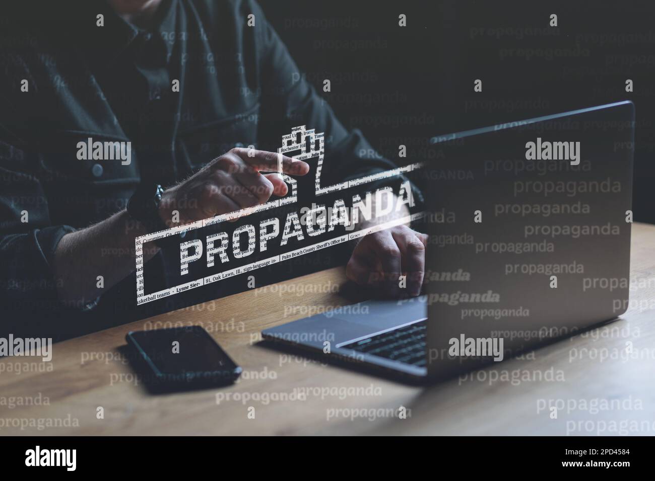 Propaganda visual concept. Man points finger at Propaganda text. High ...