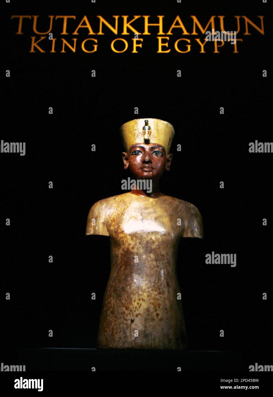 A nearly life-sized painted wooden model of King Tutankhamun ...