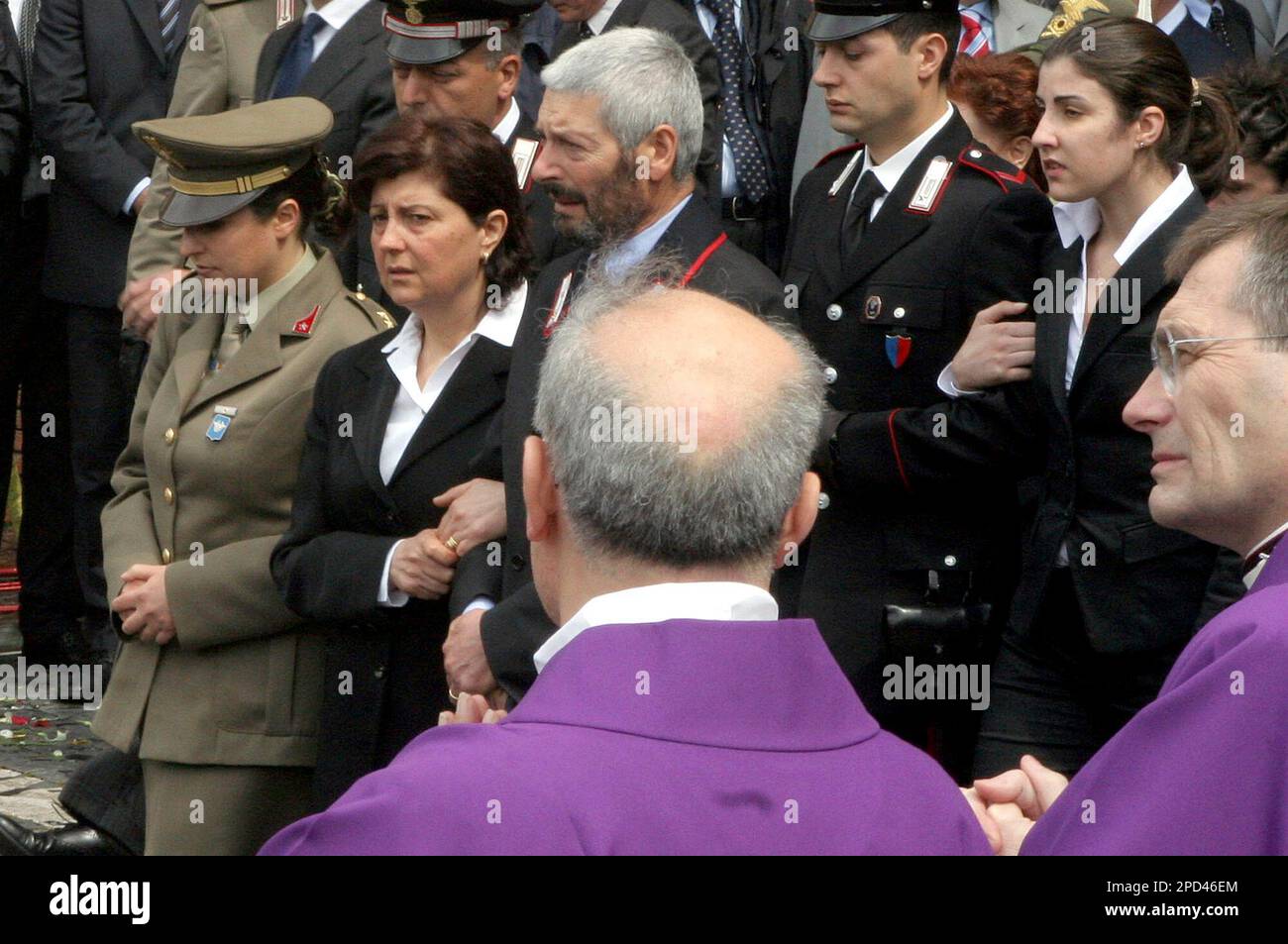 Emilio Polsinelli, center, his wife Teresa Greco, the parents of killed ...
