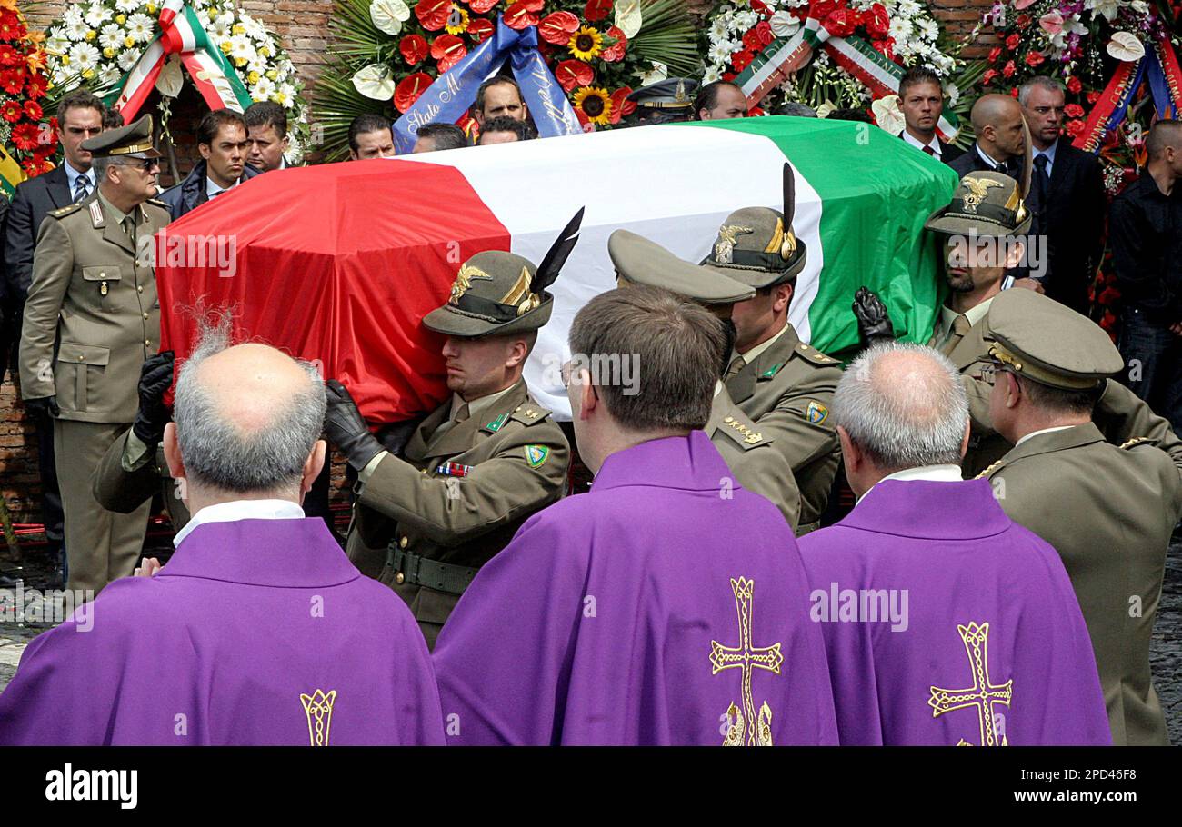 Italian Alpine soldiers carry the coffin of one of the two Alpine ...