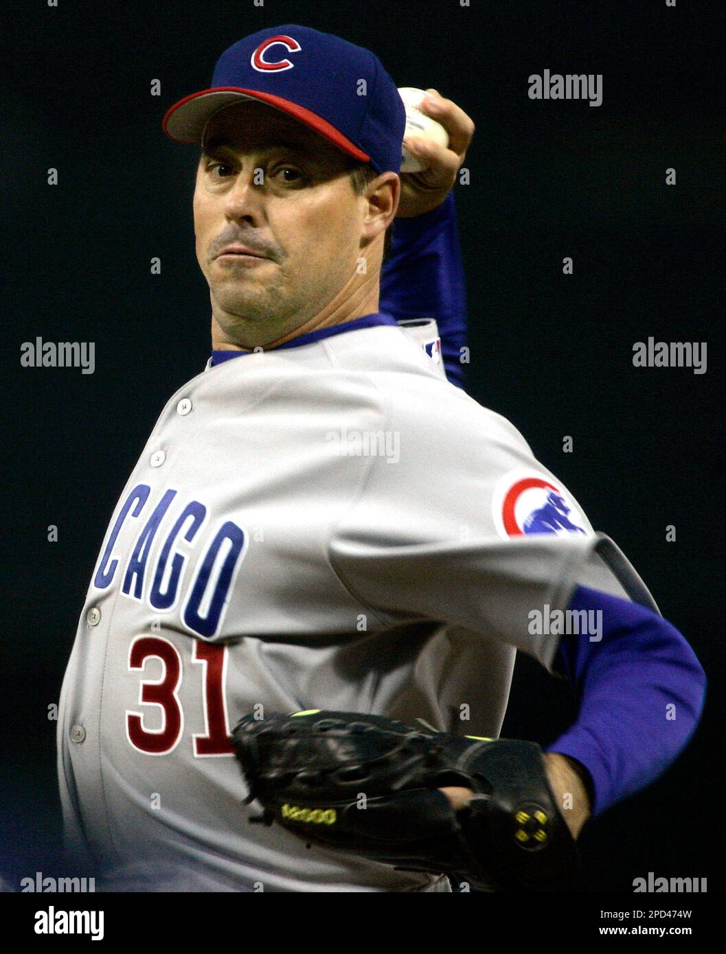 Chicago Cubs pitcher Greg Maddux delivers a pitch during the first inning of their baseball game ...