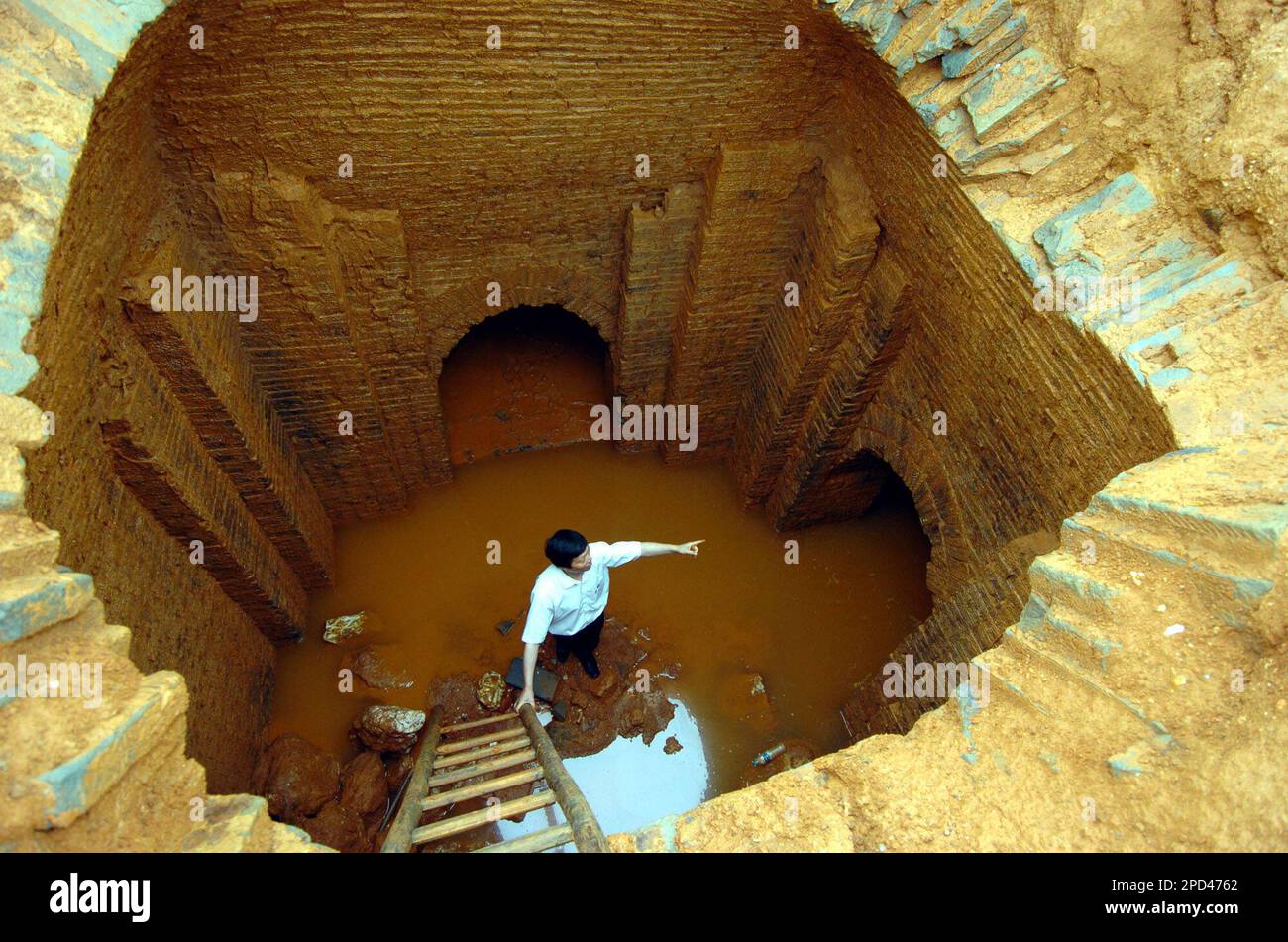 In this photo released by China's Xinhua news agency, a man stands in ...