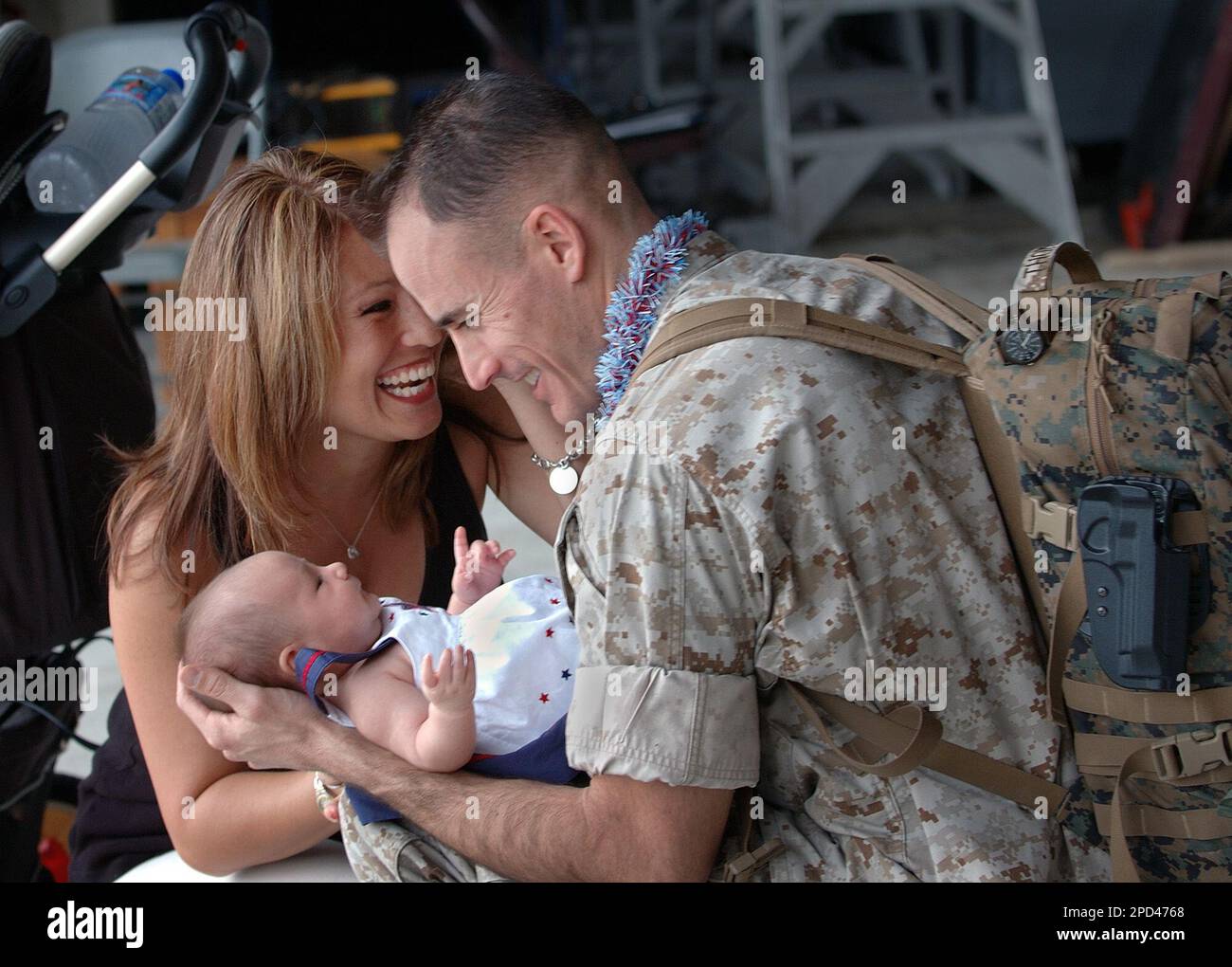 Marine Capt. Eric Thompson, of San Diego, gets his first look at his 8 ...