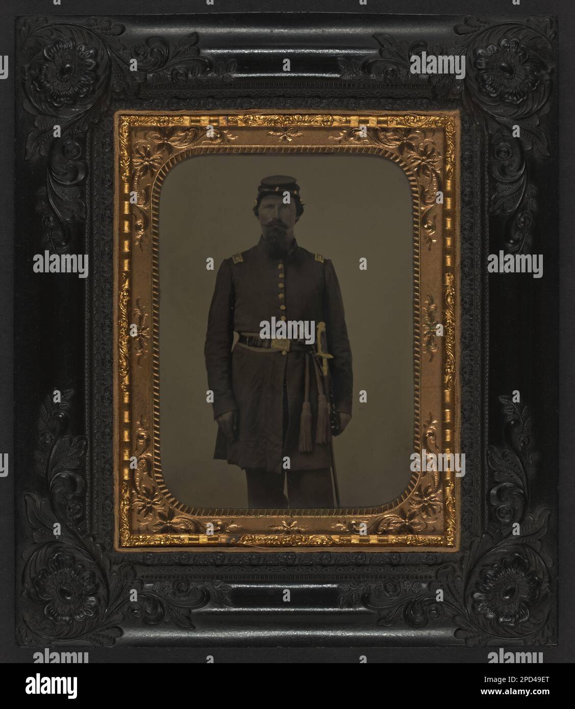 Unidentified soldier in Union captain's frock coat and officer's sash ...