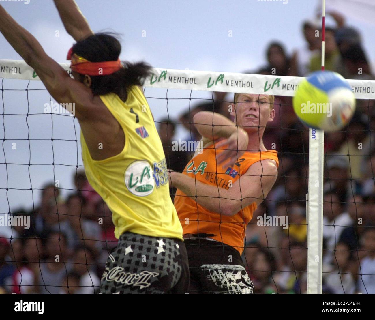 Jason Lochead, right, from New Zealand spikes the ball past Agus ...